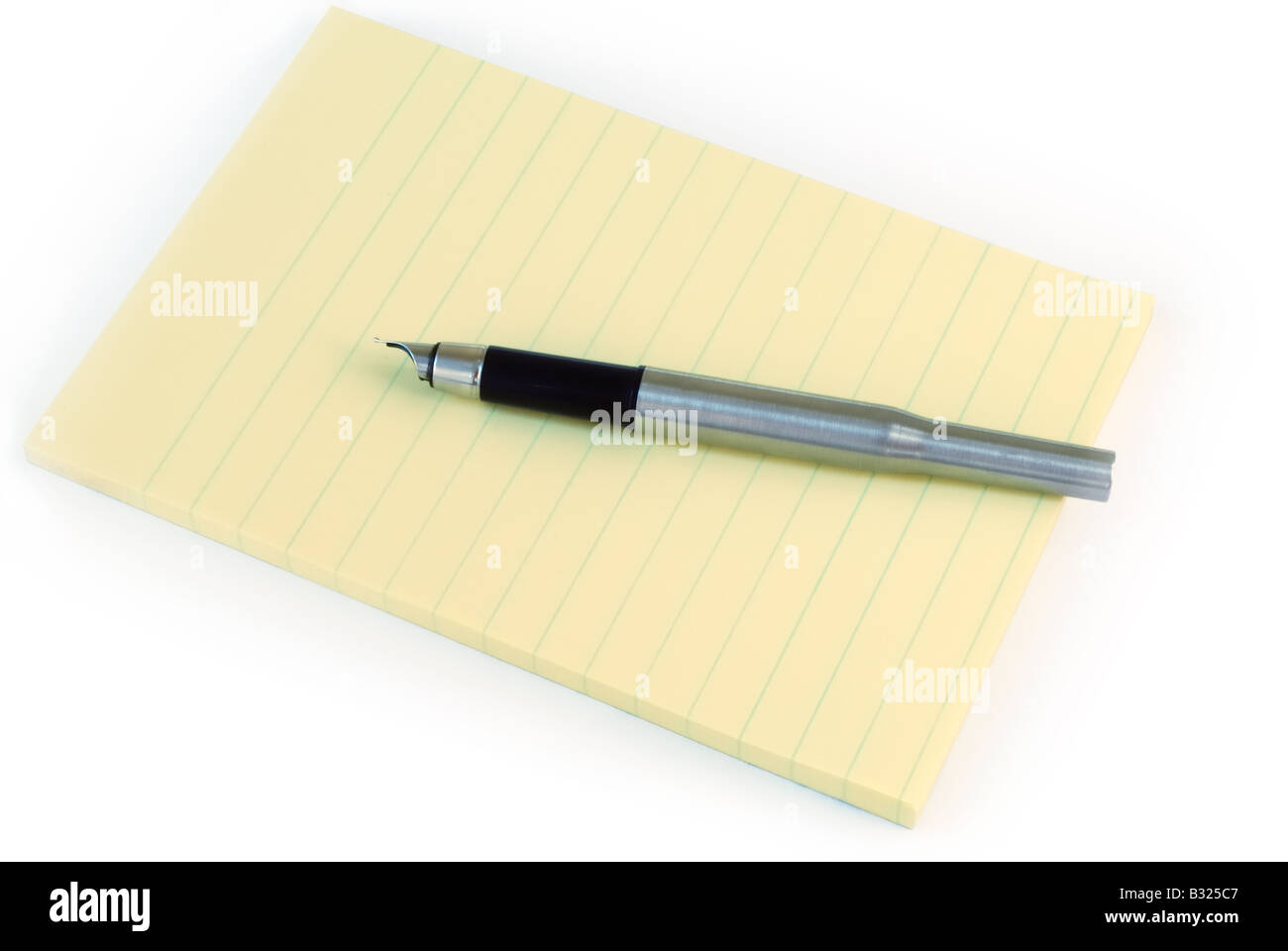Fountain writing pen and yellow note pages Stock Photo - Alamy