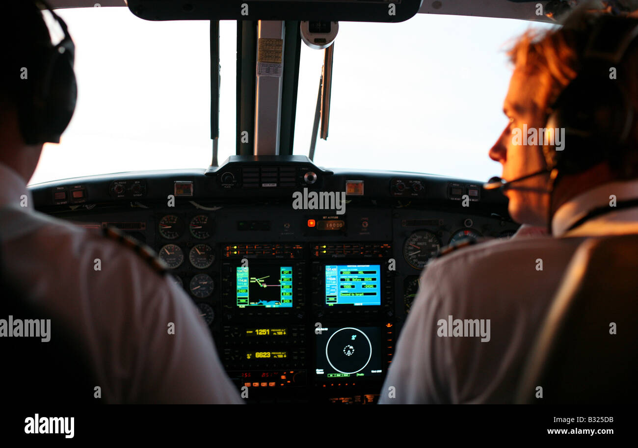 Pilots use their instruments in the cockpit of a small prop plane Stock ...