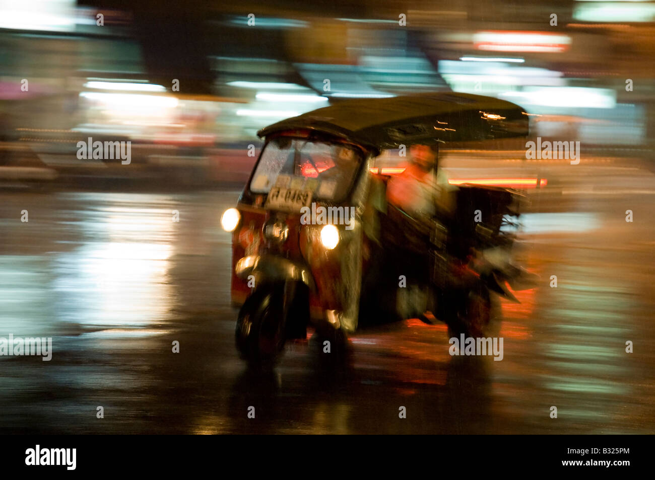A tuk tuk in motion with speed blur. Bangkok Stock Photo - Alamy