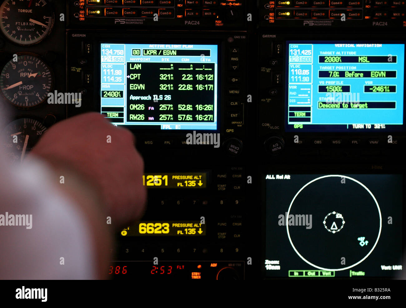 Pilots use their instruments in the cockpit of a small prop plane Stock ...