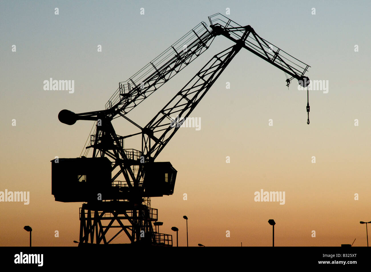 crane leverage dockyard loading unloading shipping Stock Photo - Alamy