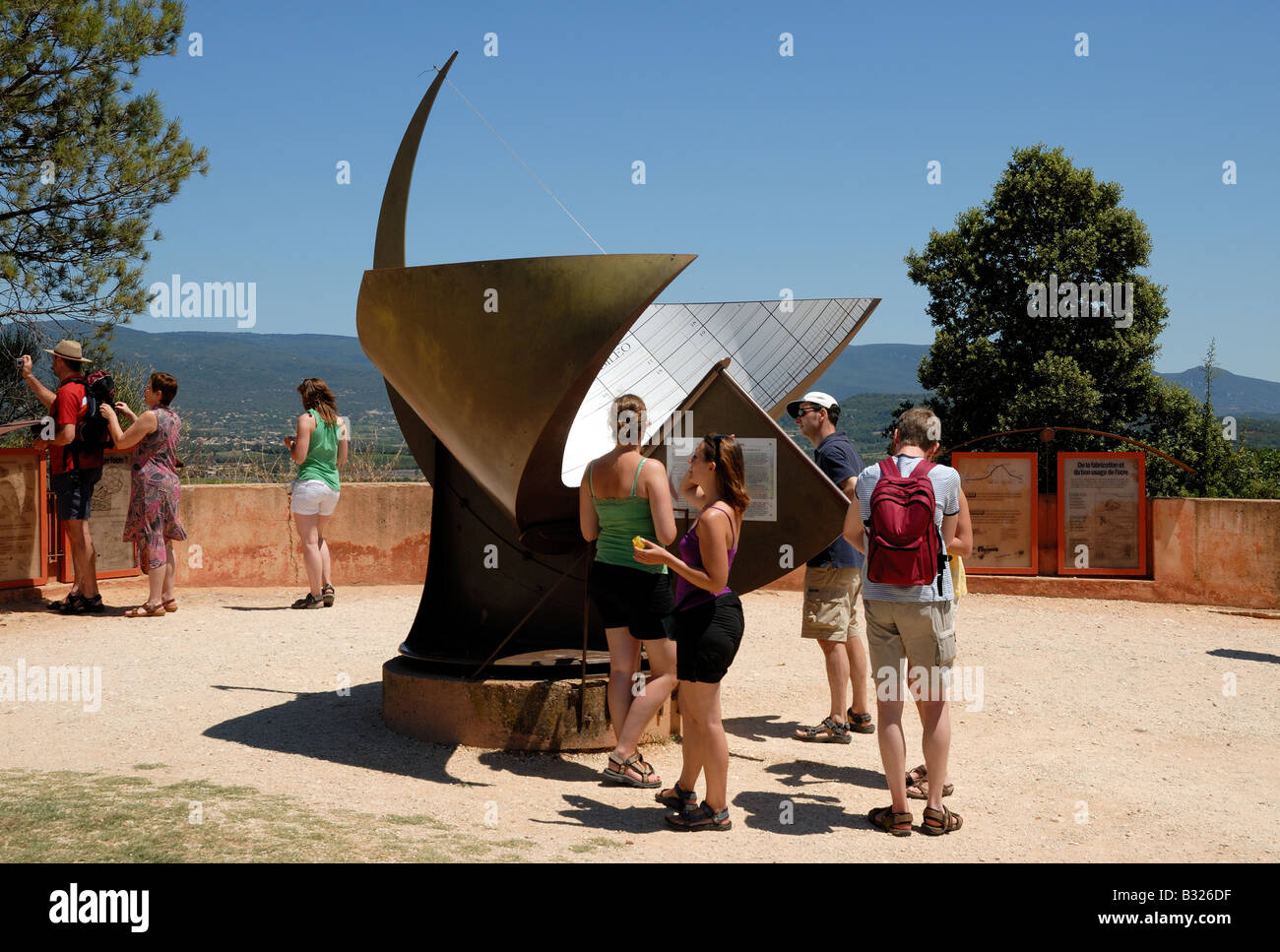 Tourists at huge sundial in Roussillon, Vaucluse France Stock Photo - Alamy