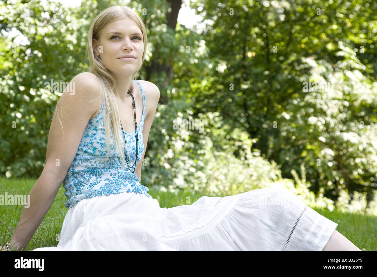 Girl in hippy style clothes sitting and relaxing in the park Stock ...