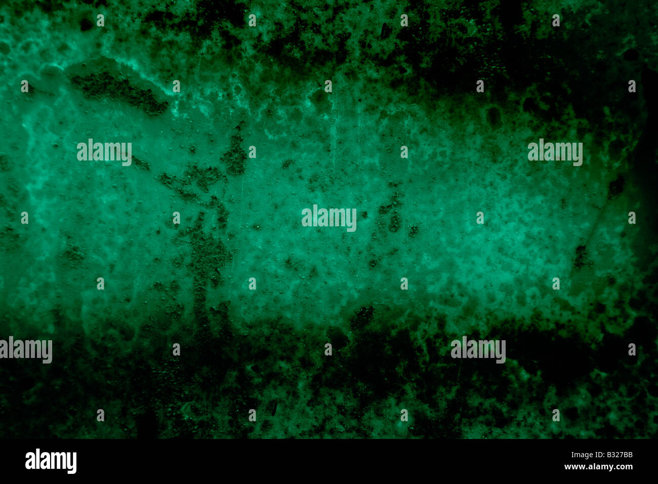 Light casting shadow over dark green scratched rusty background Stock ...