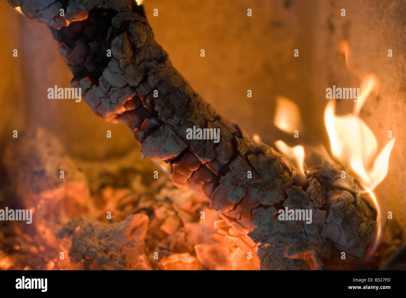log fire in a fireplace - close-up of a burning log of wood Stock Photo ...