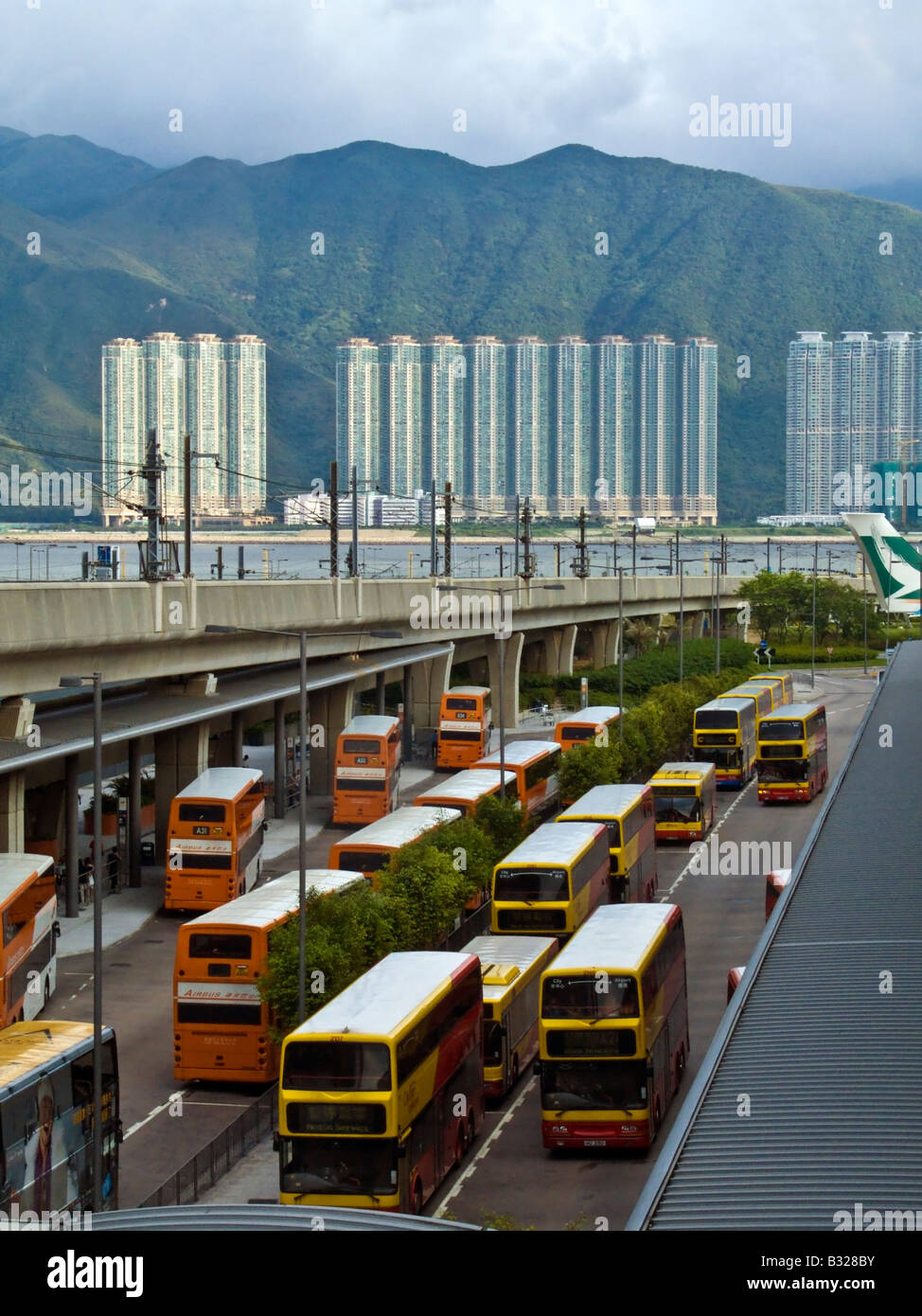 Bus station at Hong Kong International Airport with skyscrapers in the ...