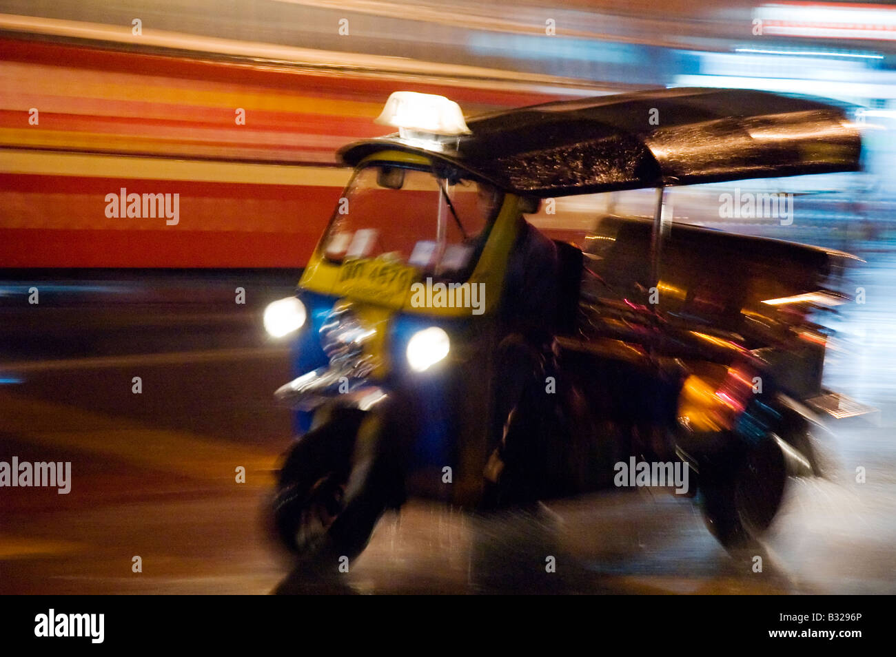 A tuk tuk in motion with speed blur. Bangkok Stock Photo - Alamy