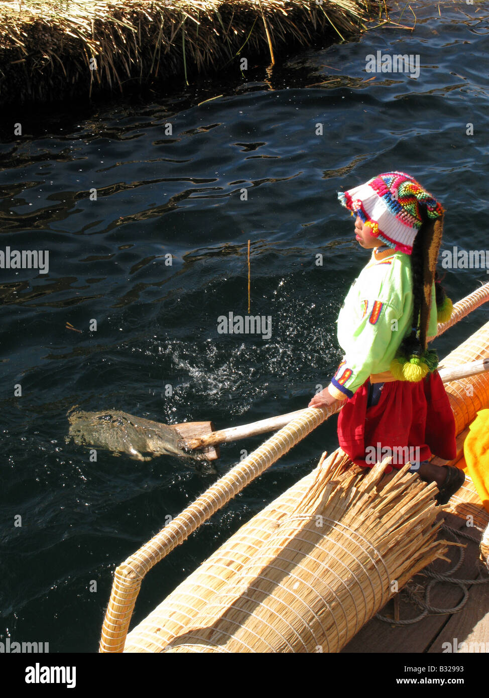 A Uros girl people a pre-Incan people living on self-fashioned floating ...