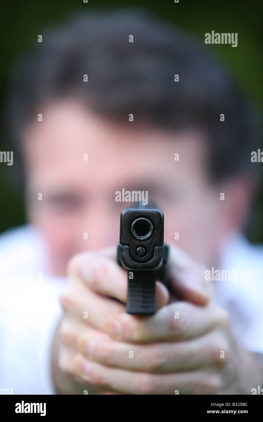 Hitman with gun Stock Photo - Alamy