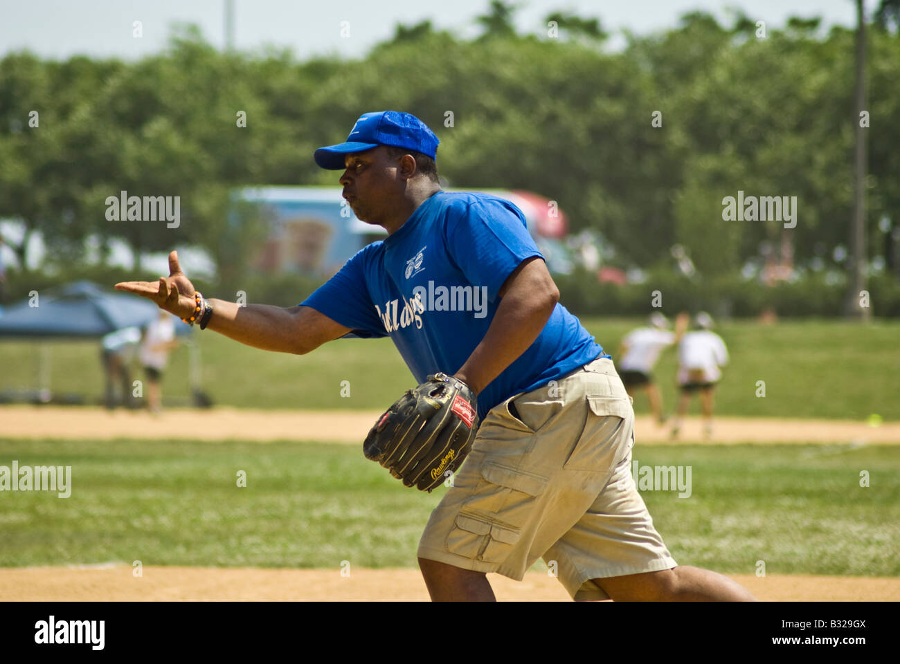 A man pitches at a Special Olympics softball tournament Stock Photo - Alamy