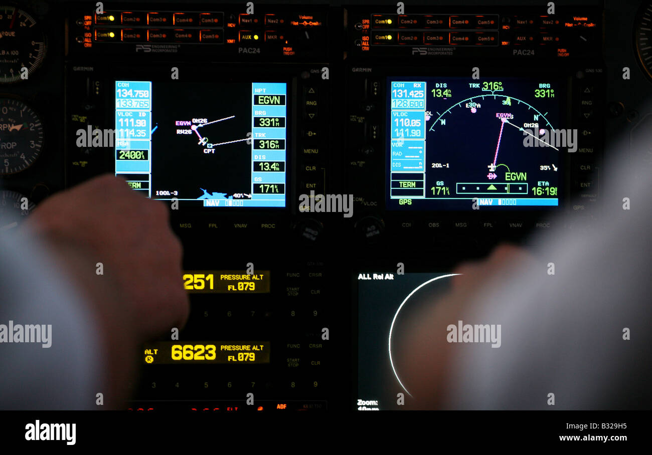 Pilots use their instruments in the cockpit of a small prop plane Stock ...