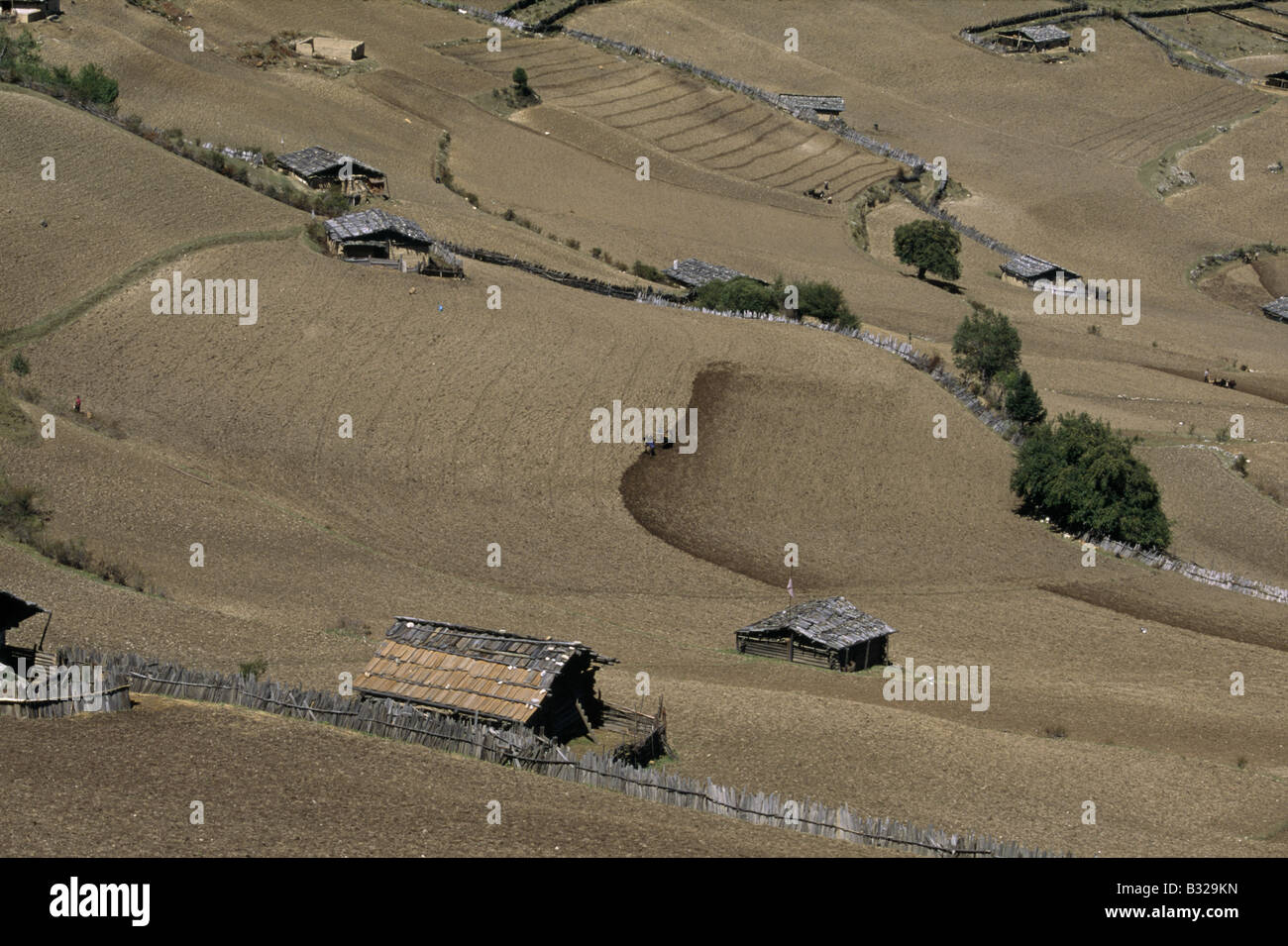 Eastern Tibet View across landscape Farm buildings Small fields Bare ...