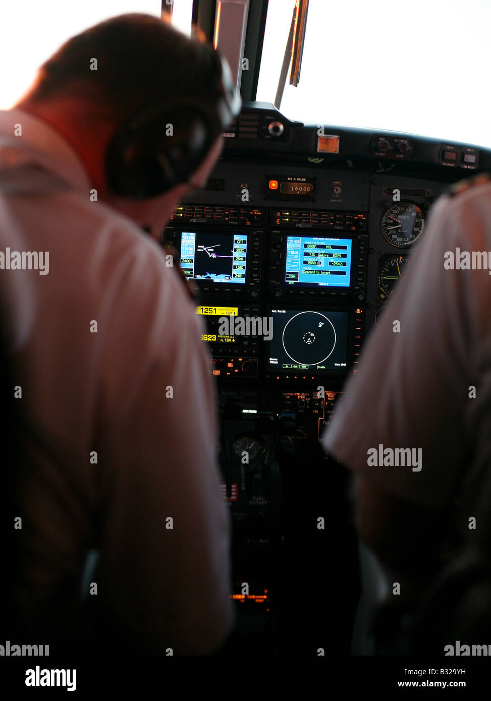 Pilots use their instruments in the cockpit of a small prop plane Stock ...