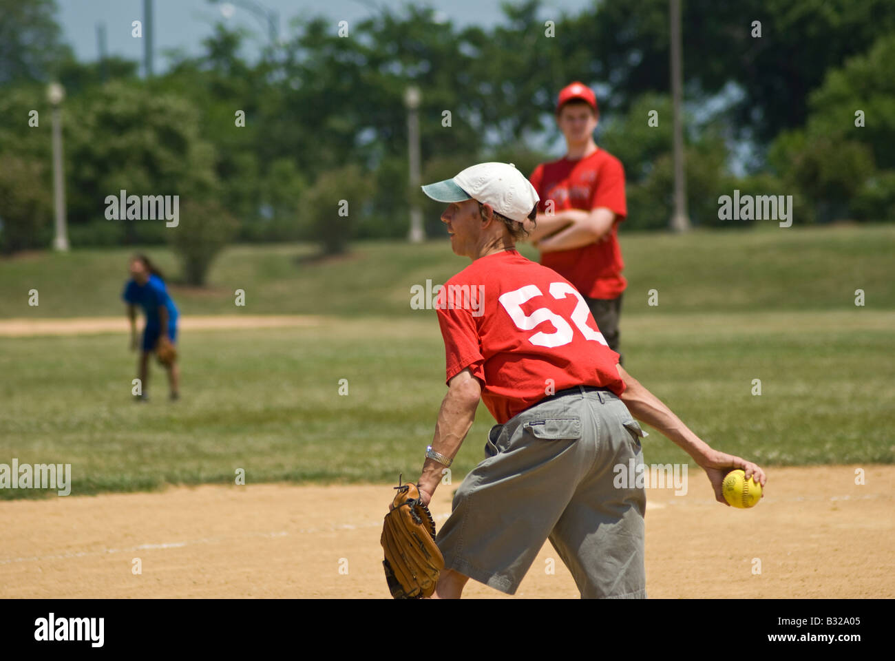Toss underhand hi-res stock photography and images - Alamy