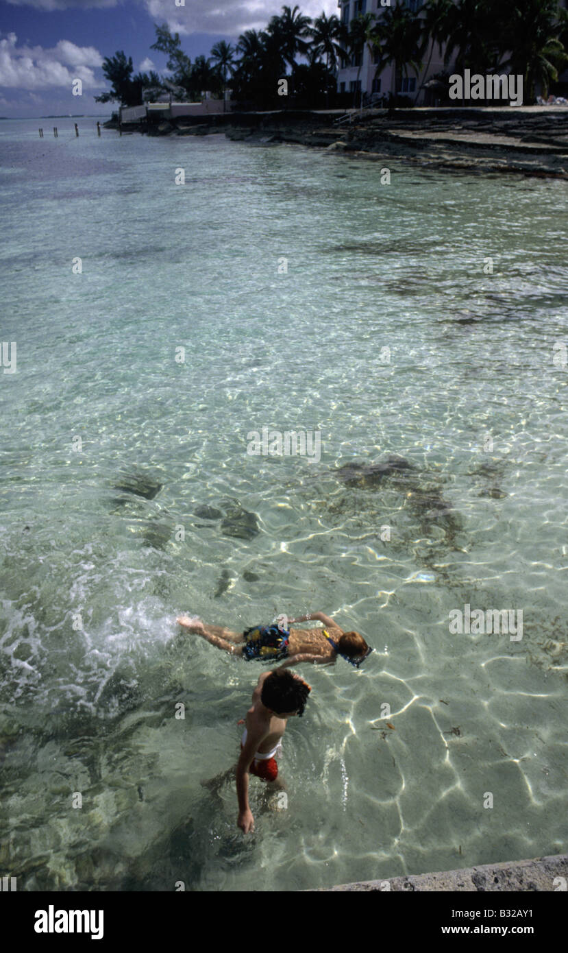 Two boys snorkling in clear sea at Meridian Royal Bahamian Hotel Edge ...