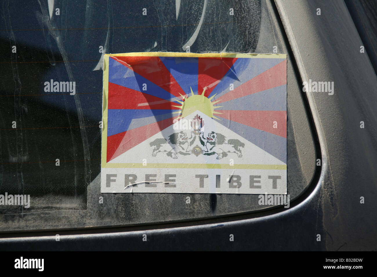 free tibet flag sticker on dirty car window Stock Photo - Alamy