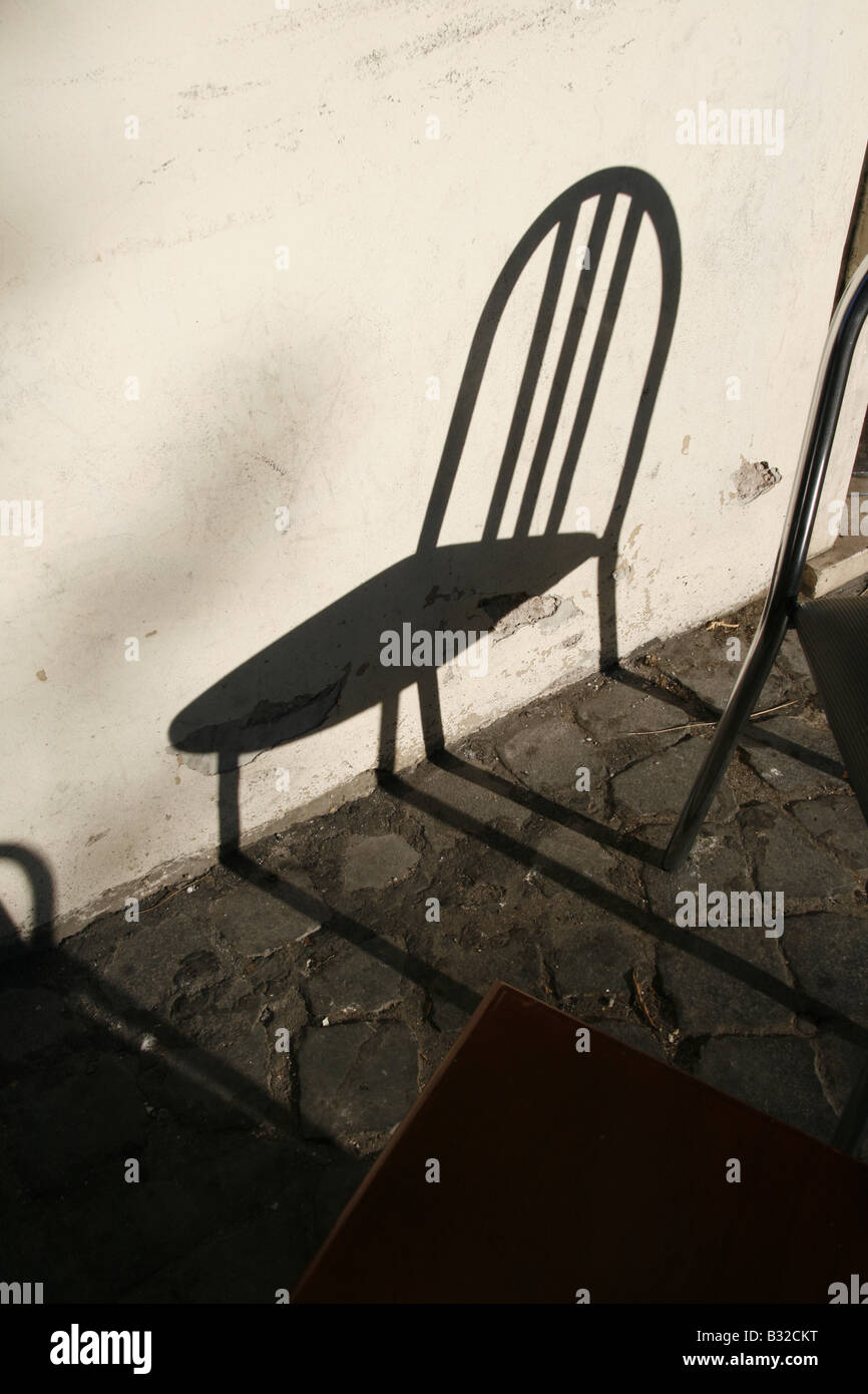 one single chair shadow on wall outdoors Stock Photo - Alamy