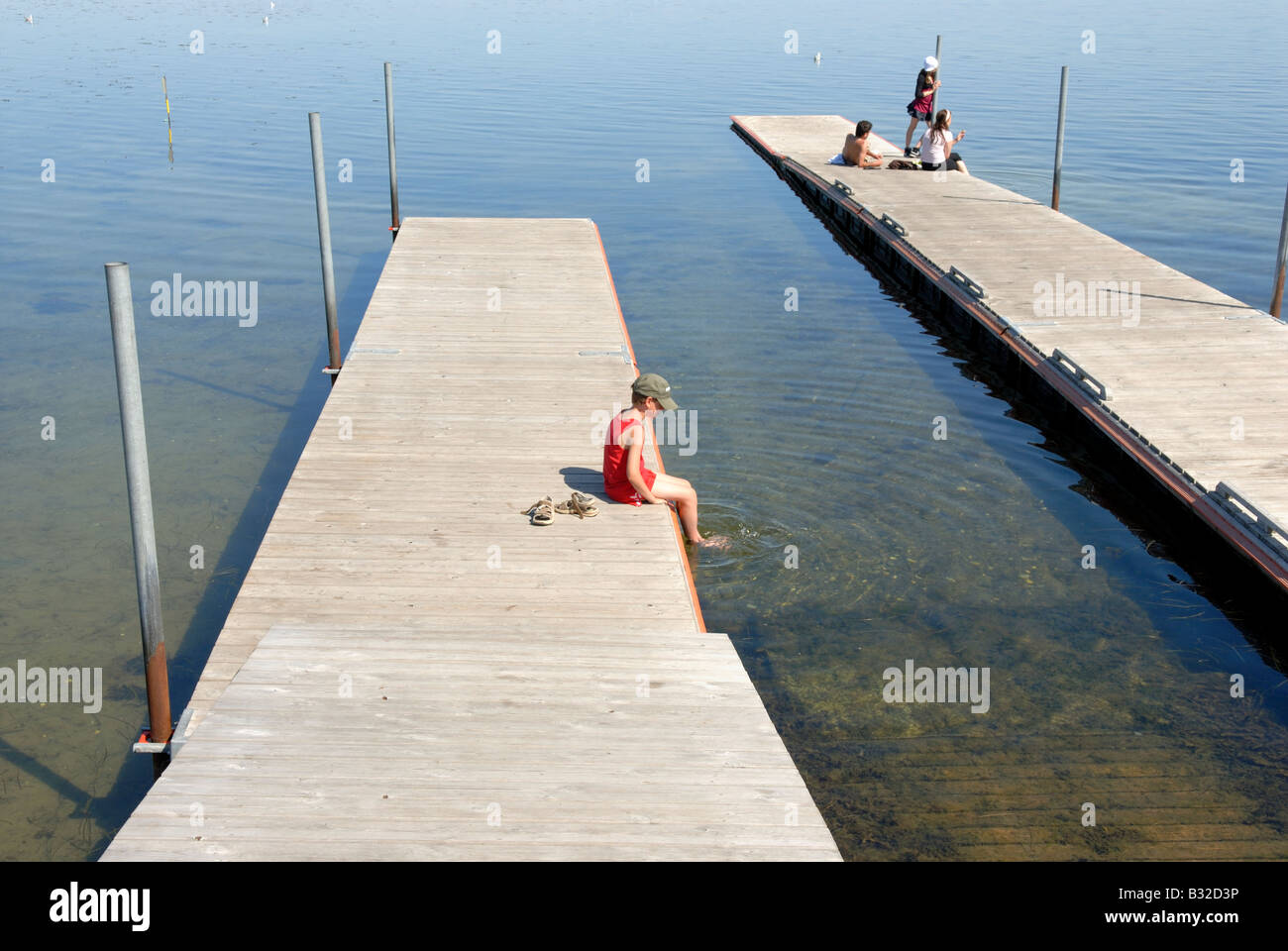 BOY ON A JETTY Stock Photo - Alamy