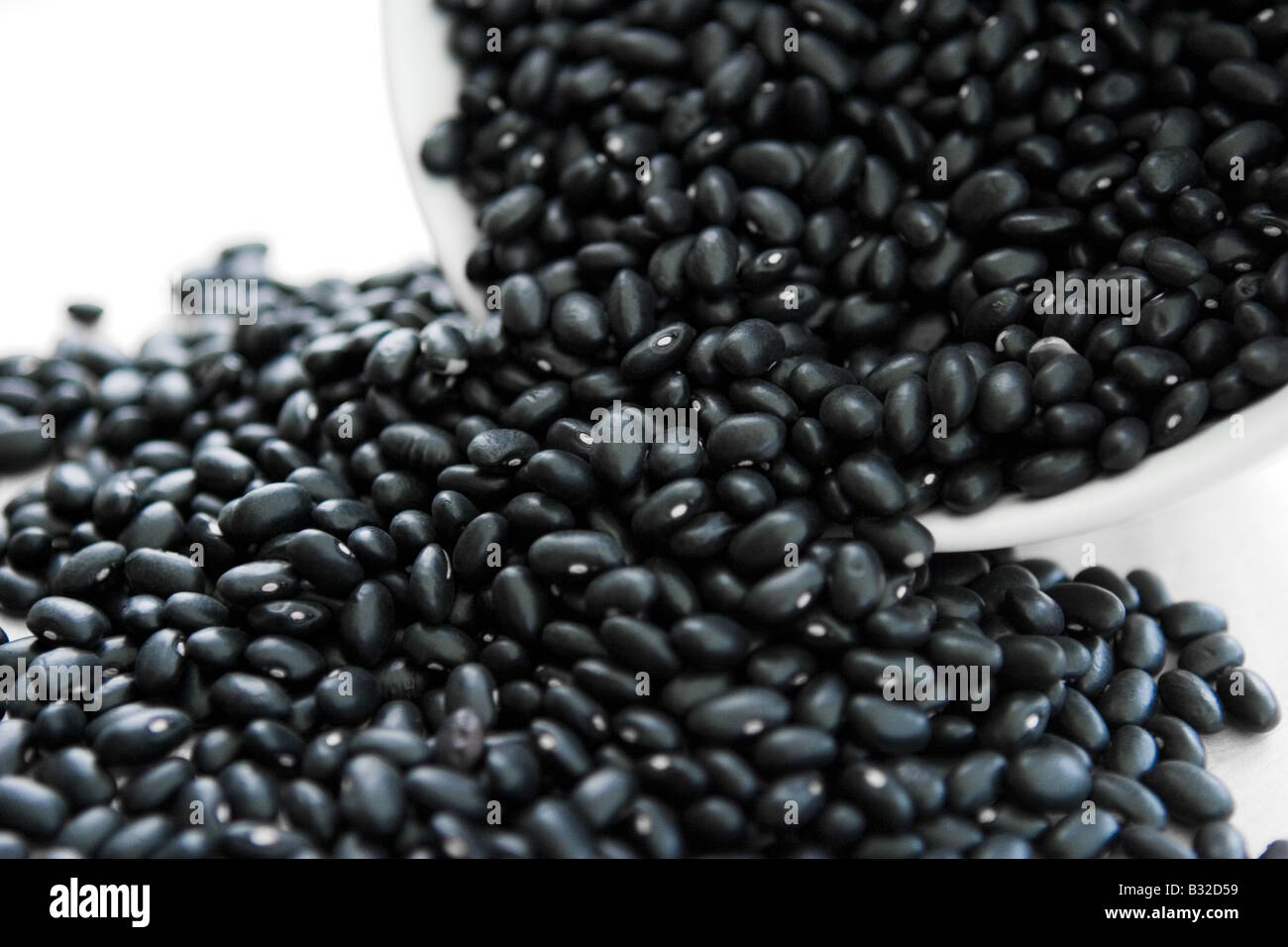 Black Turtle Beans in White Bowl Stock Photo - Alamy