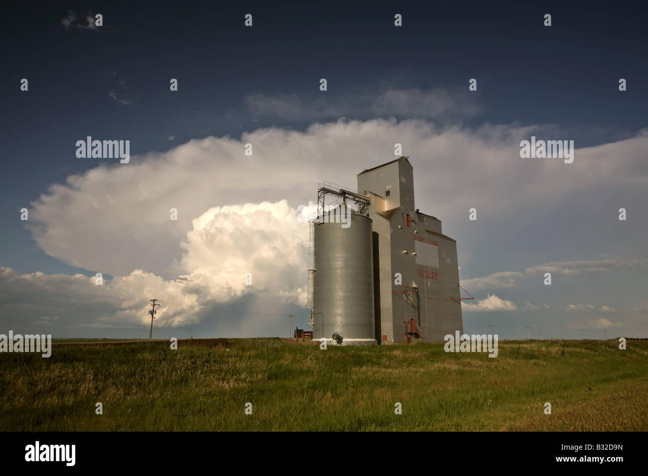 Storm clouds behind Saskatchewan grain terminal Stock Photo - Alamy