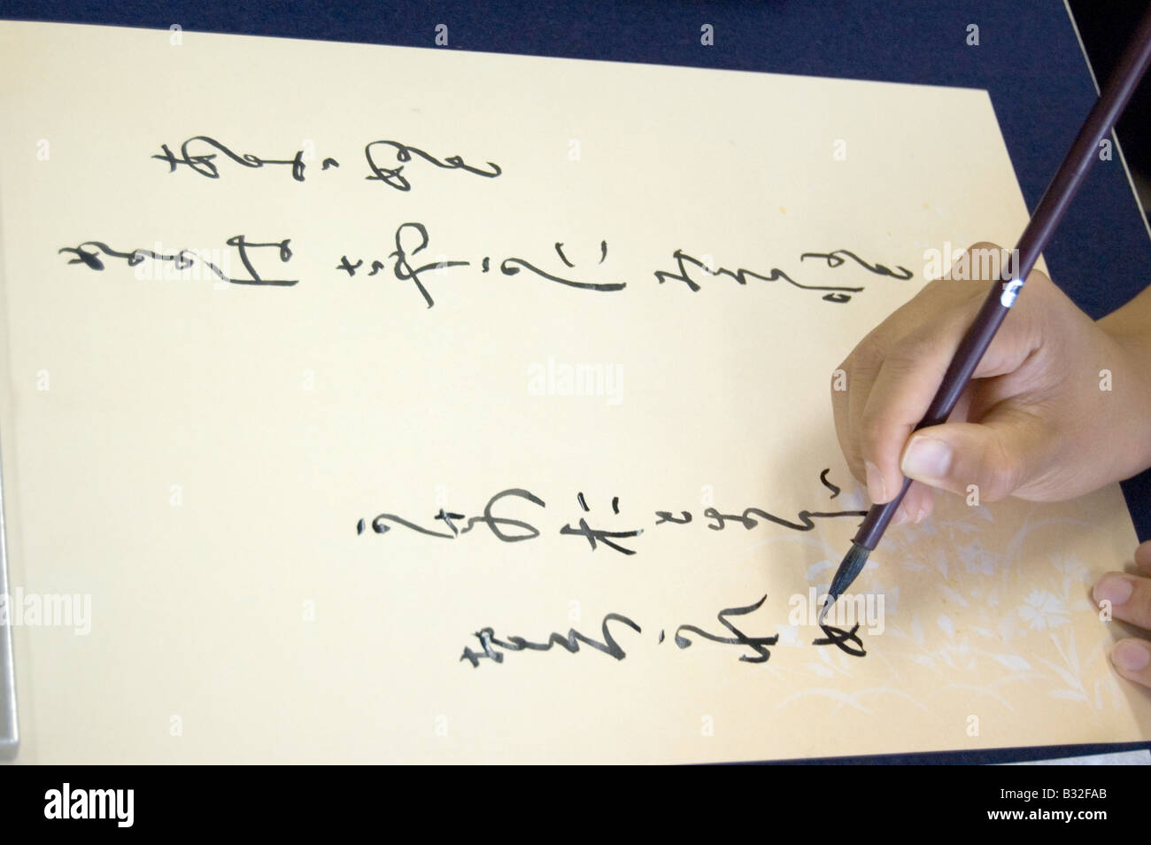 Japanese high school student practices calligraphy Stock Photo - Alamy