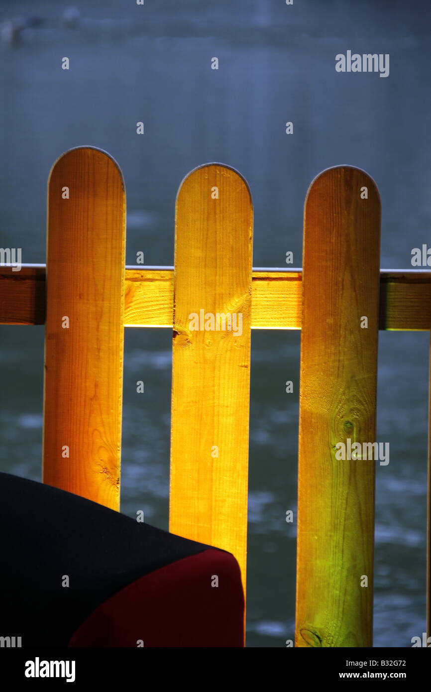 one wooden gate fence illuminated night outdoors Stock Photo - Alamy