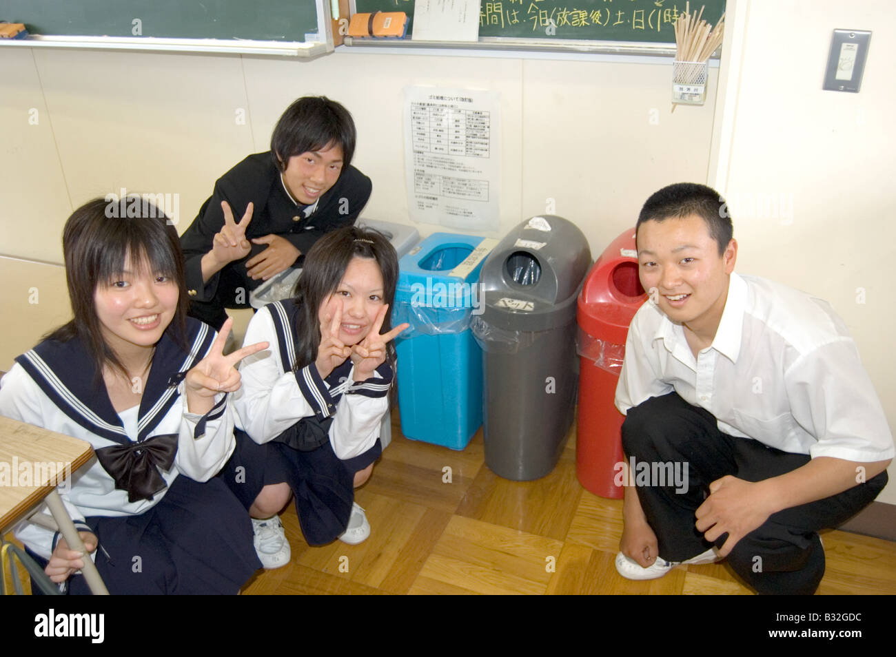 Japanese high school students posing by recycling bins Stock Photo - Alamy