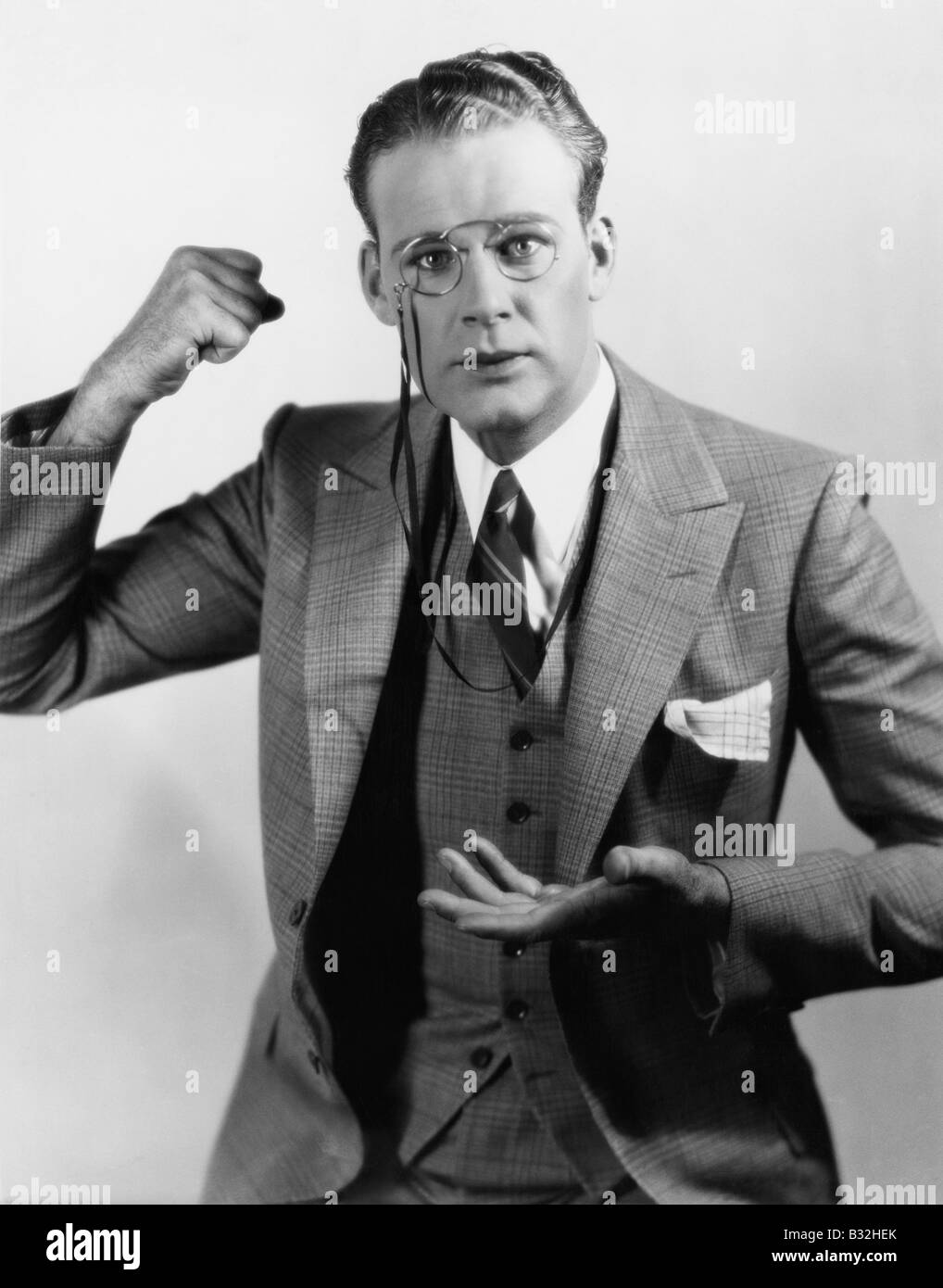 Young man focused expression points hi-res stock photography and images ...