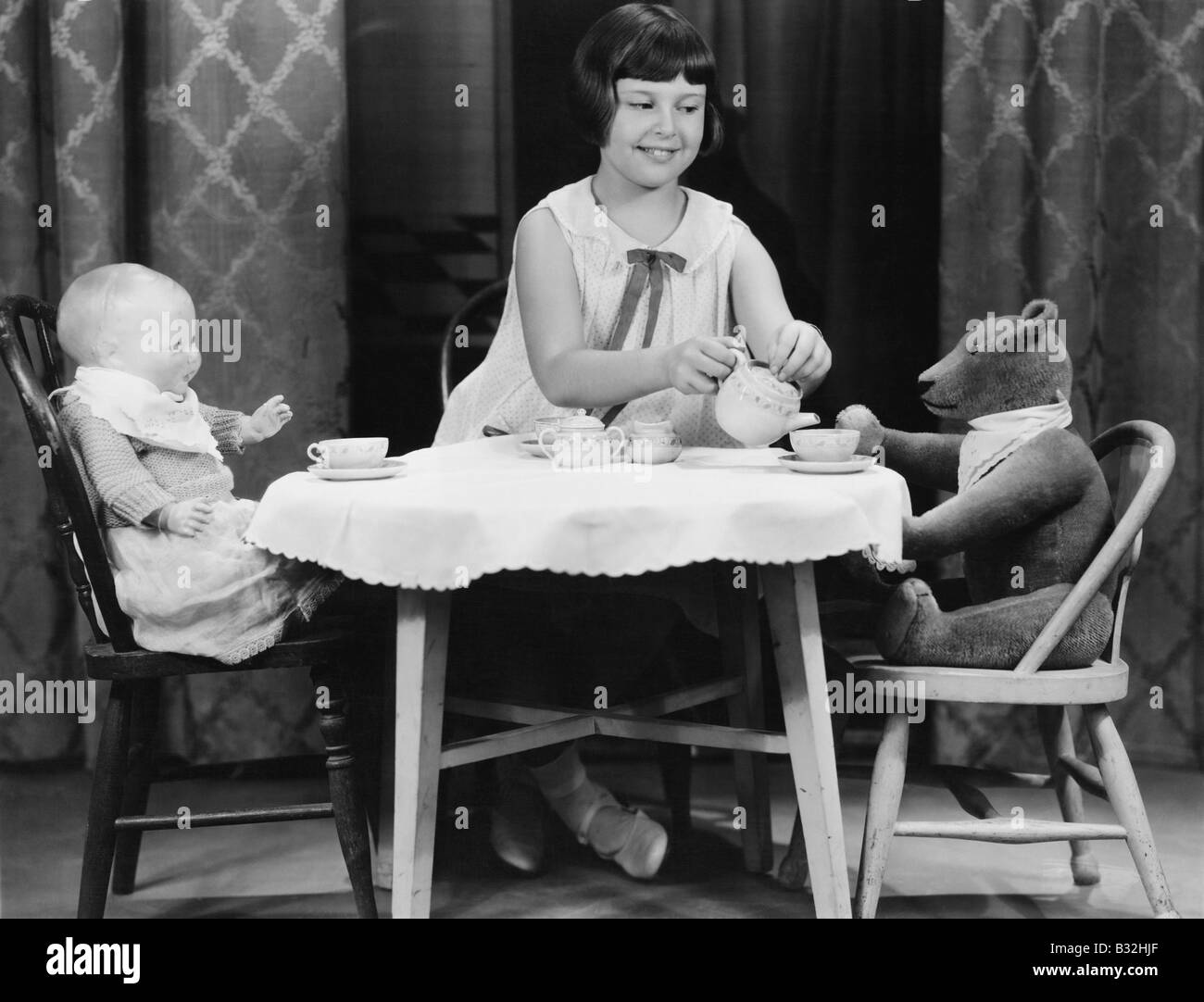 Children children tea party dolls hi-res stock photography and images ...