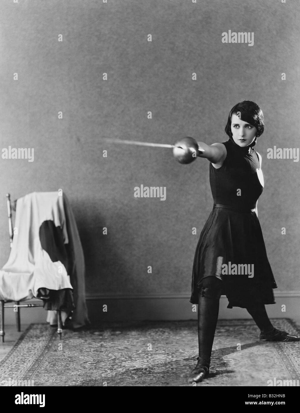 Dramatic pose woman sword hi-res stock photography and images - Alamy