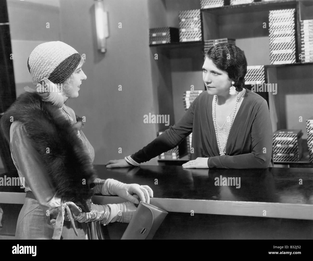Female sales clerk talking hi-res stock photography and images - Alamy