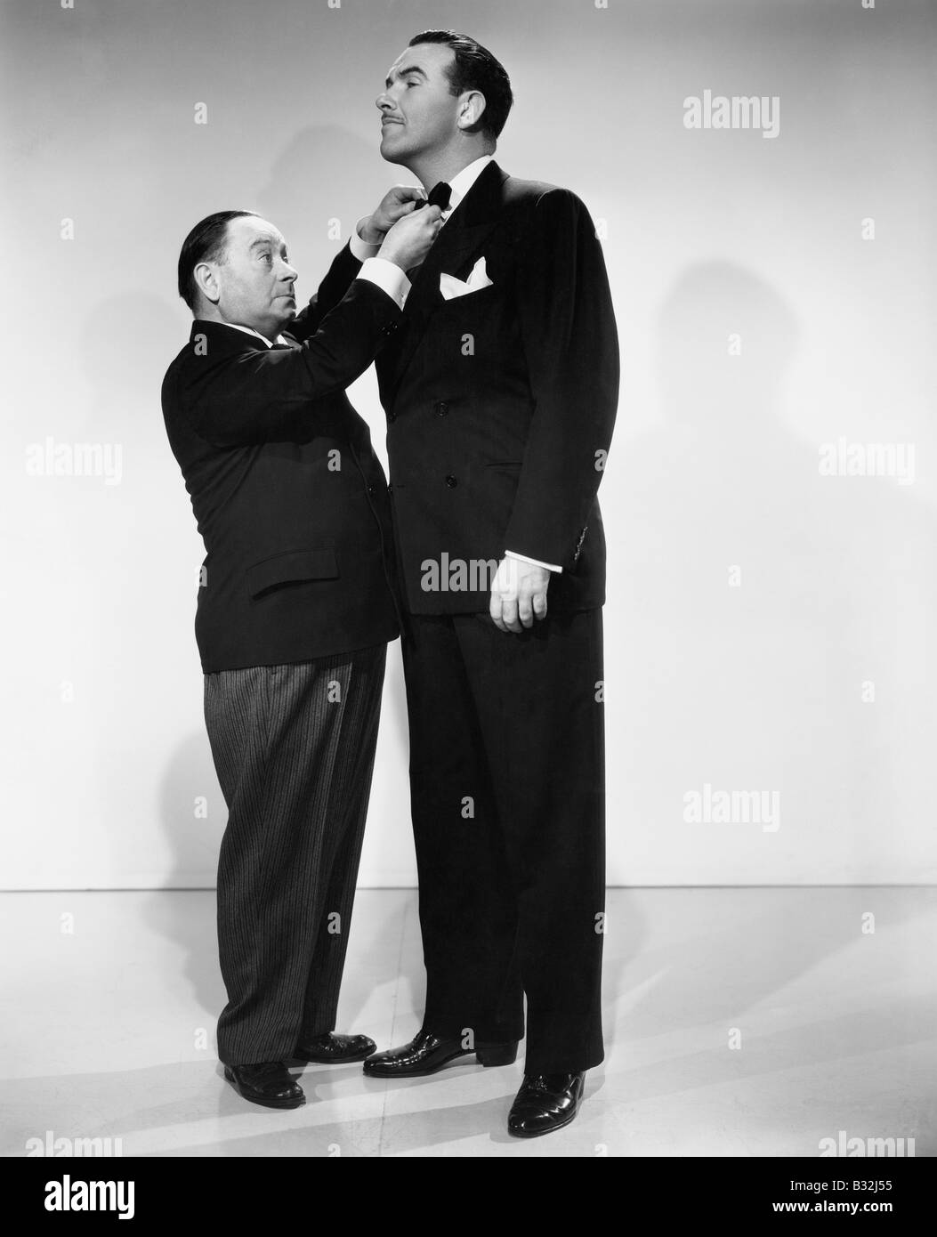 Comparing height hi-res stock photography and images - Alamy