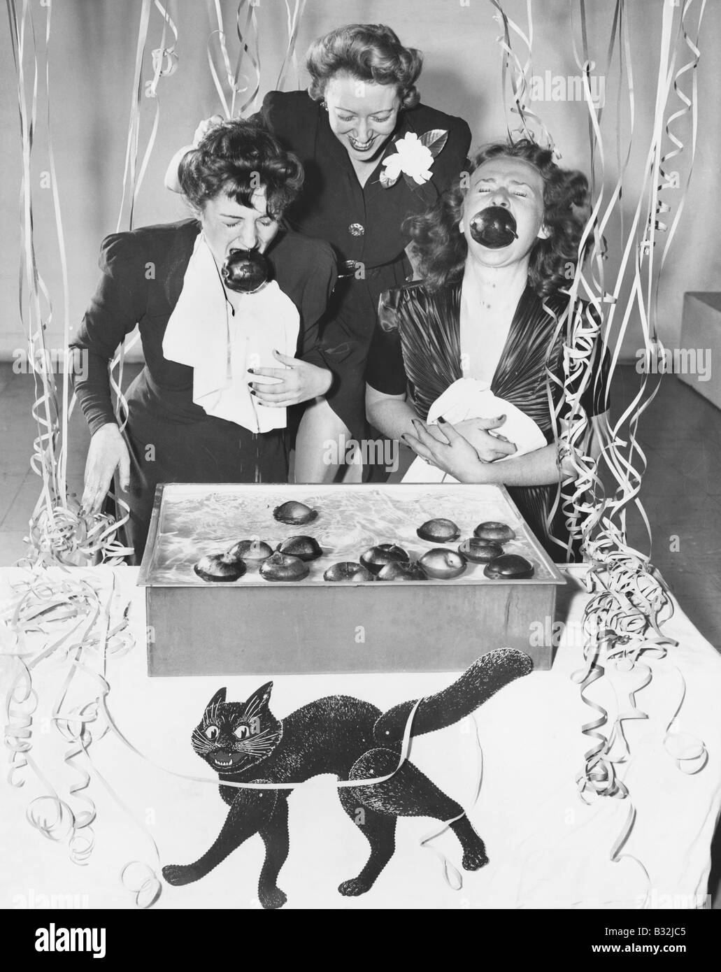 Apple bobbing adult hi-res stock photography and images - Alamy