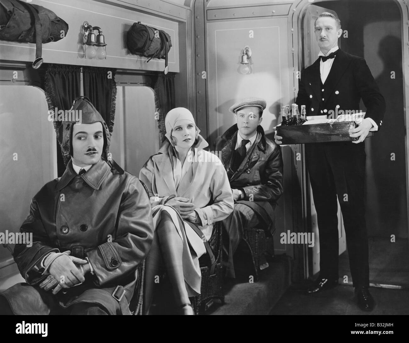 Train first class passengers seated Black and White Stock Photos ...