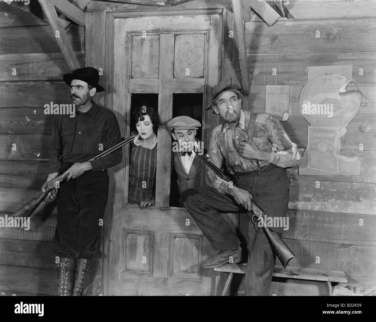 Armed men holding couple hostage Stock Photo - Alamy