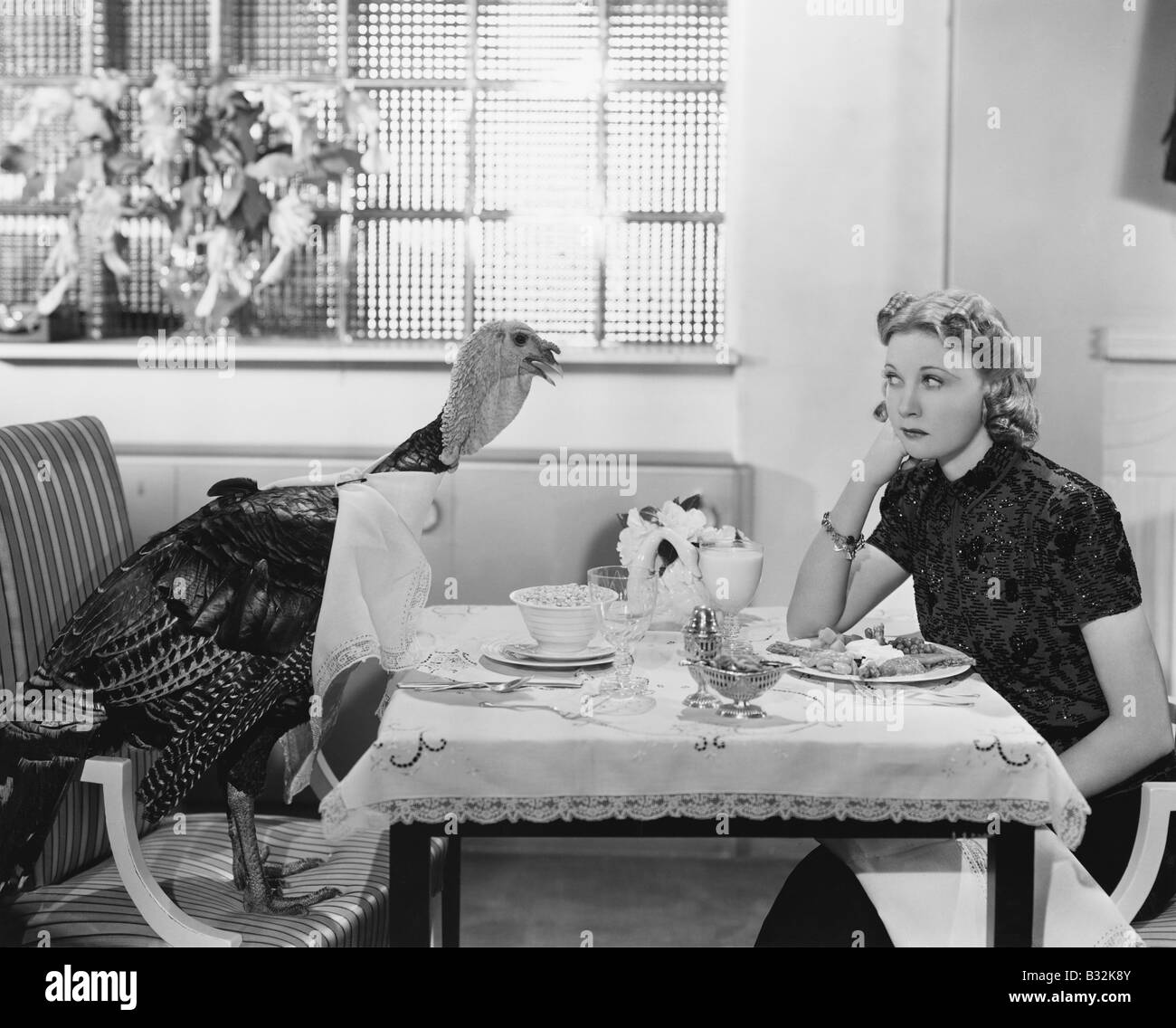 Adult woman sitting table home Black and White Stock Photos & Images ...