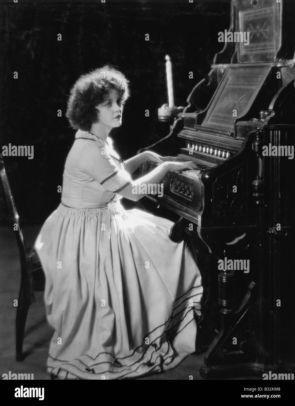 Portrait of woman playing organ Stock Photo - Alamy