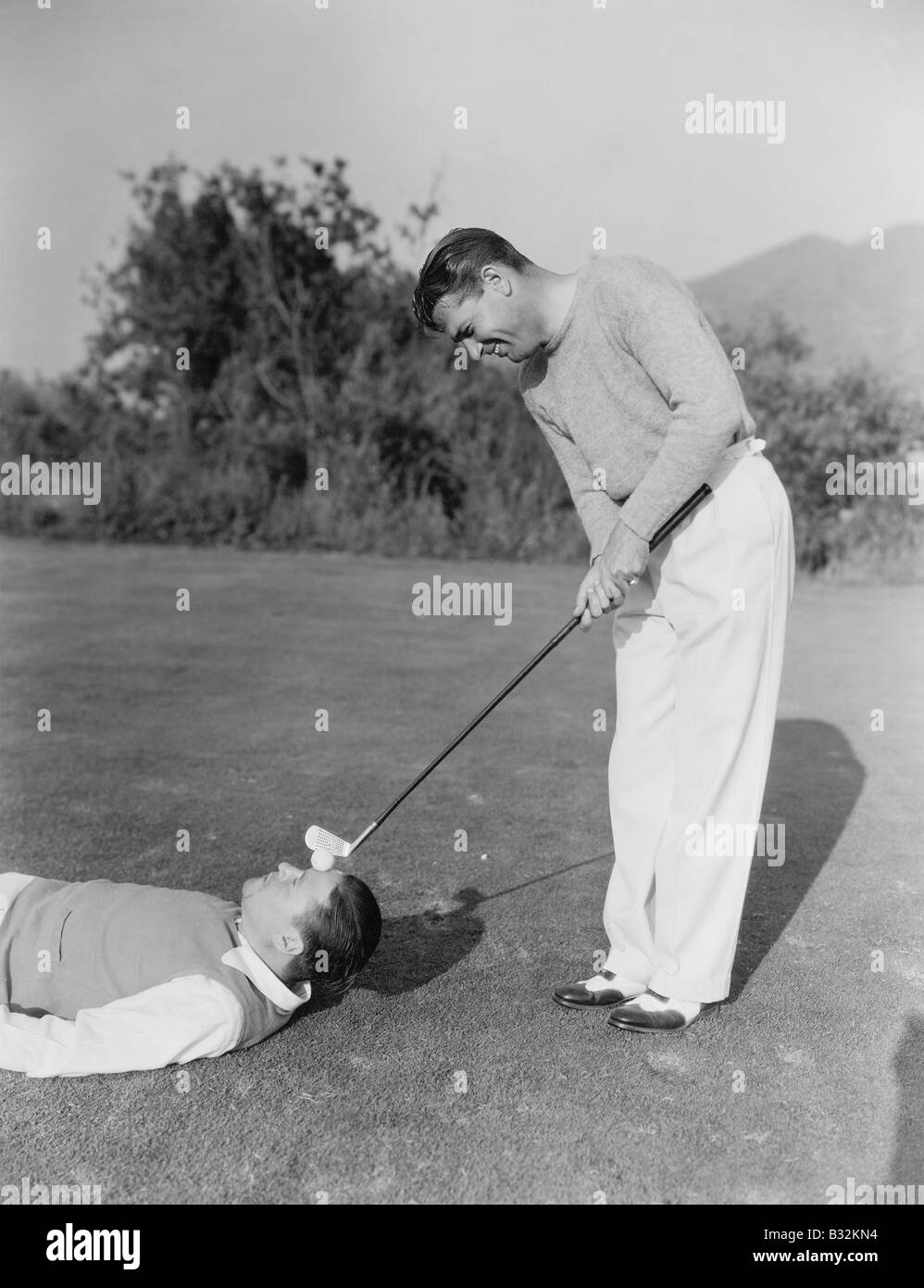 Man hitting golf ball Black and White Stock Photos & Images - Alamy