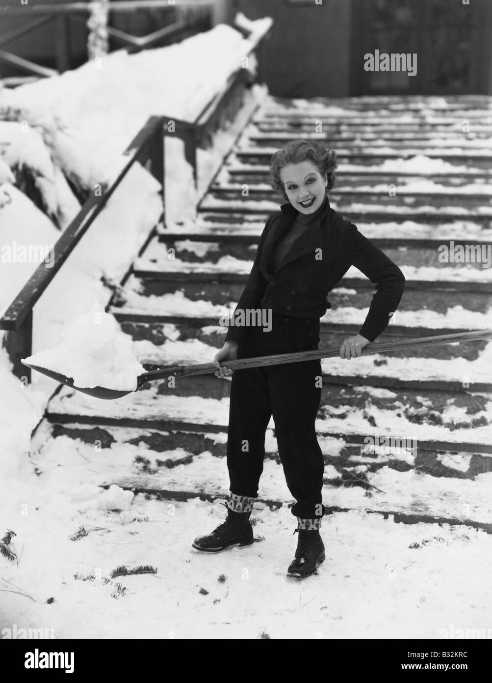 Shoveling snow Black and White Stock Photos & Images - Alamy