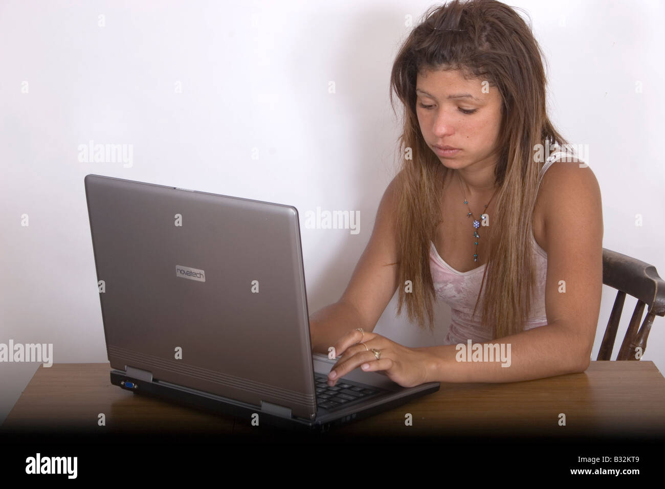 unhappy teenage girl on laptop computer Stock Photo - Alamy