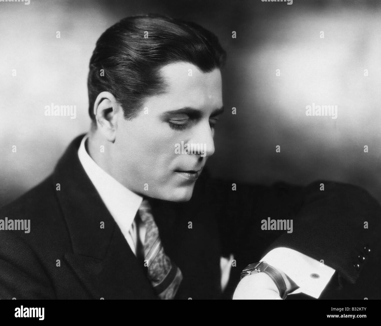 Handsome man checking time Black and White Stock Photos & Images - Alamy