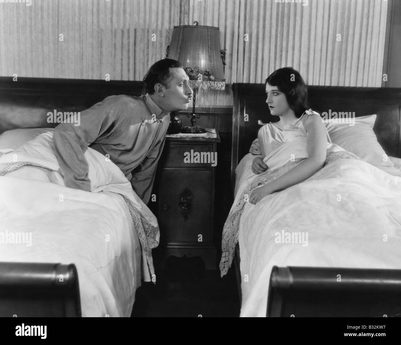 Male and female in separate beds hi-res stock photography and images ...