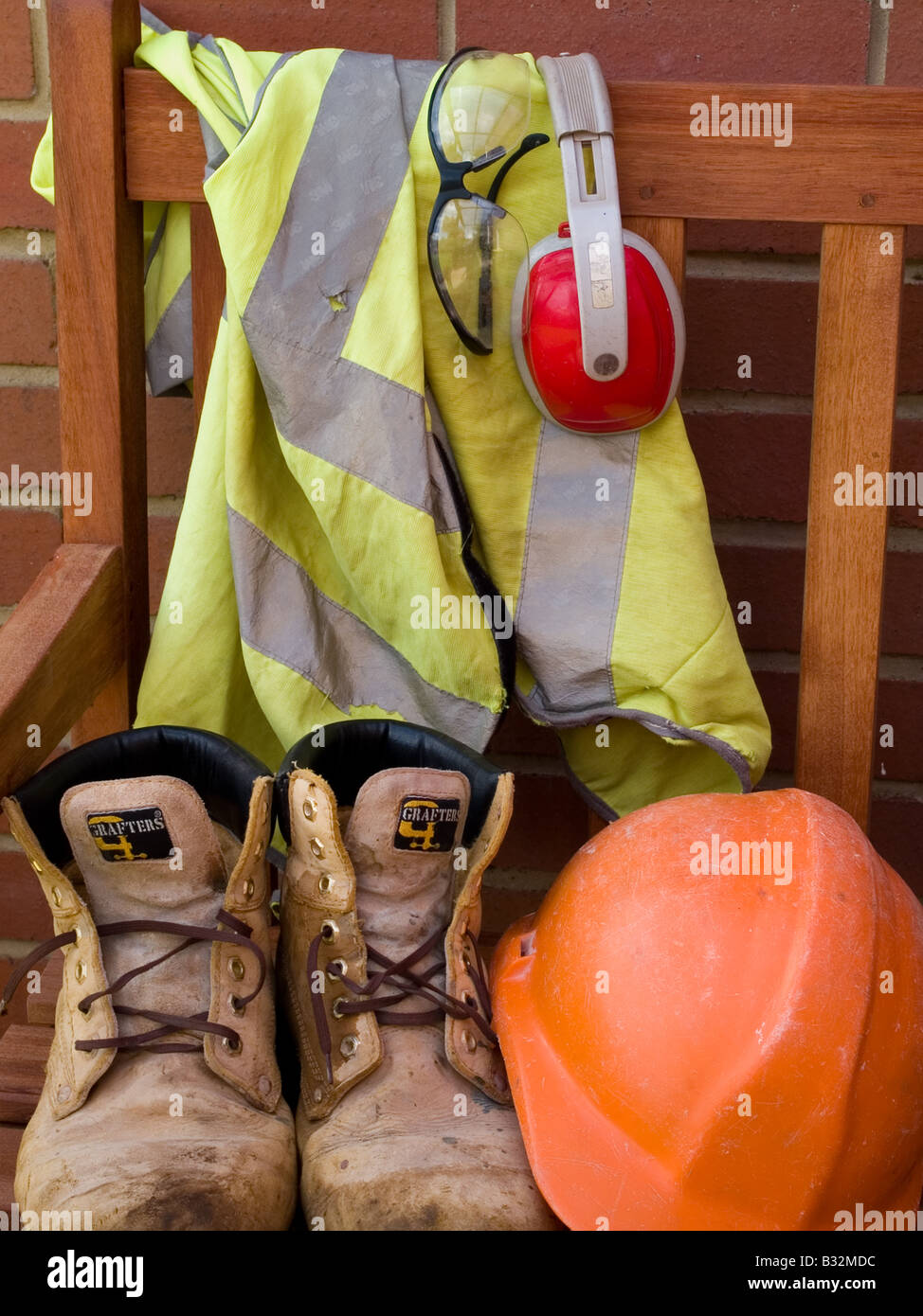 high vis jacket hard hat ear defenders boots Stock Photo - Alamy