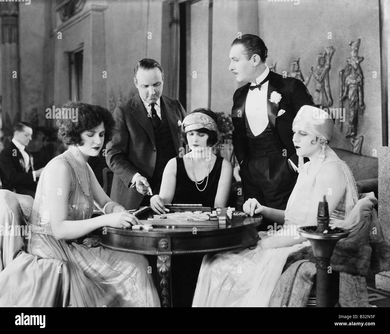 Wealthy people playing game Stock Photo - Alamy