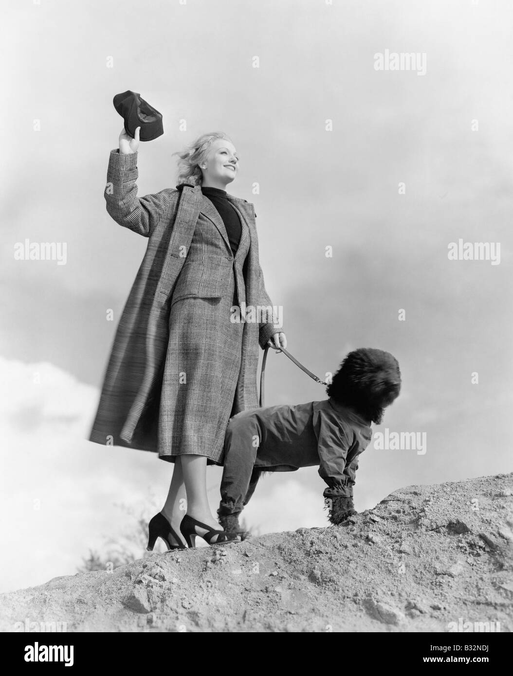 Walking into wind Black and White Stock Photos & Images - Alamy