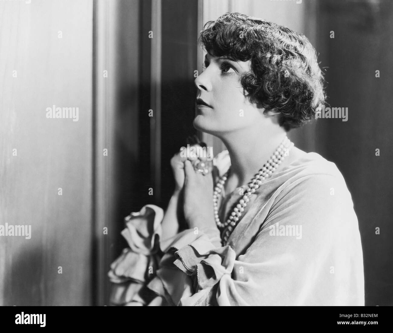 Portrait of hopeful woman Stock Photo - Alamy