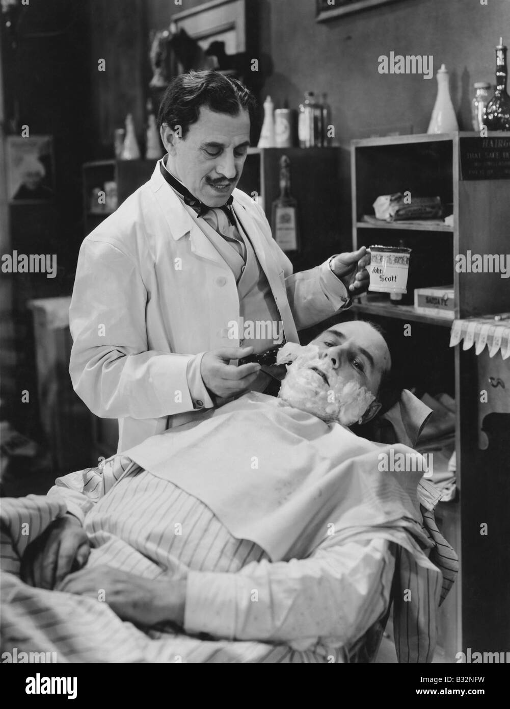 Barbers shaving Black and White Stock Photos & Images - Alamy