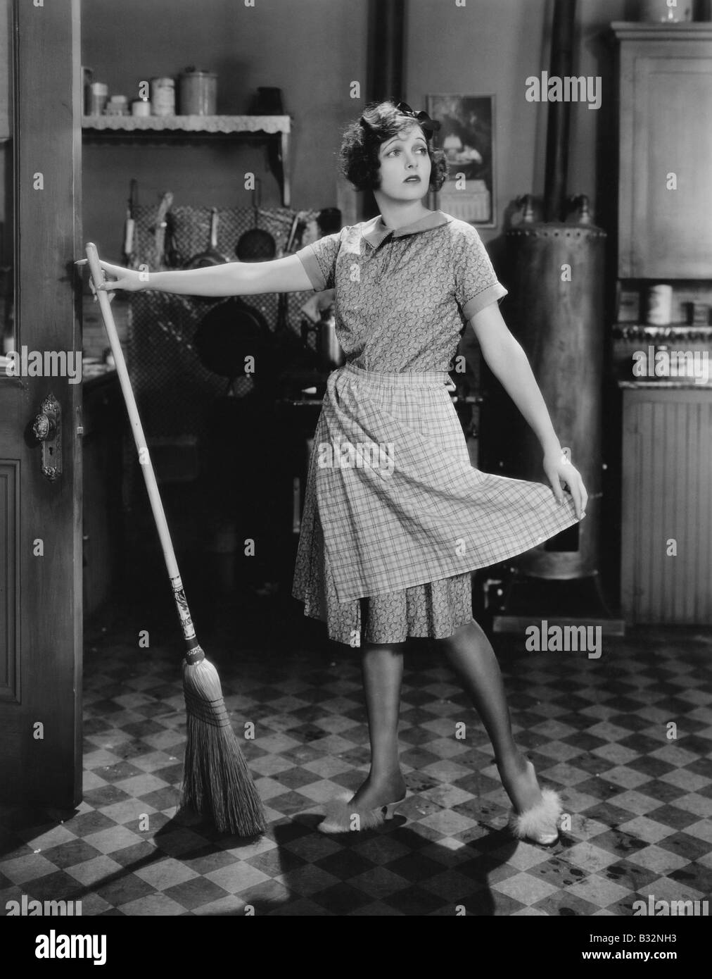 Woman with broom Stock Photo - Alamy