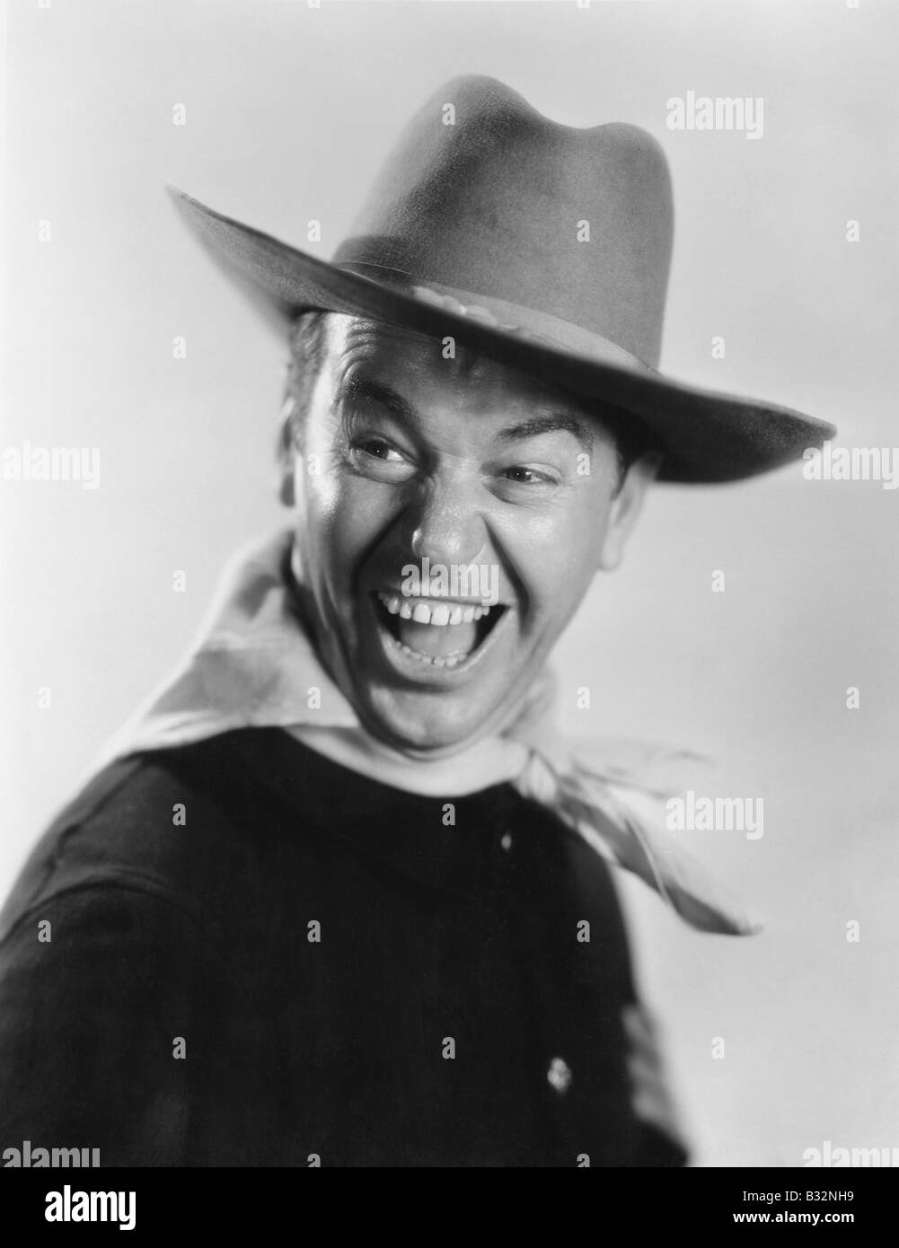 Laughing man cowboy hat hi-res stock photography and images - Alamy