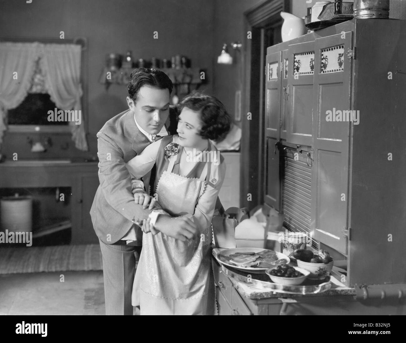 Couple man woman cooking Black and White Stock Photos & Images - Alamy
